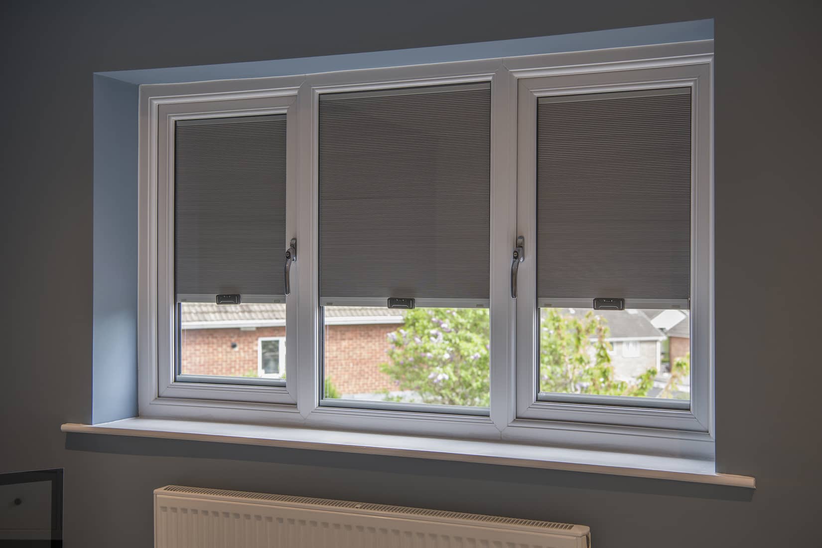 Feeling the heat? Try integral blackout blinds! - Alexander Windows